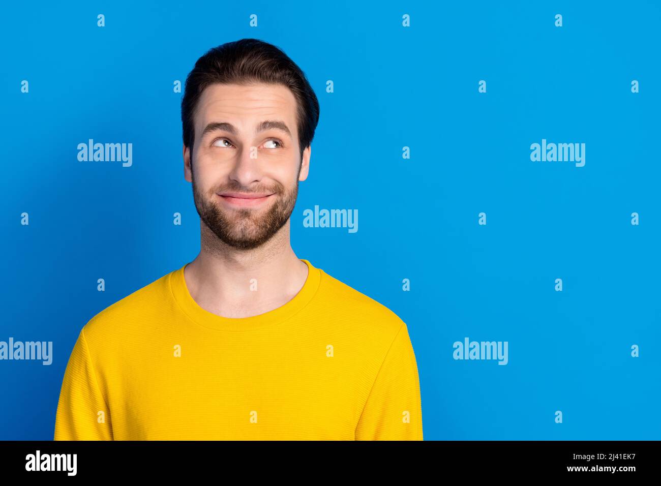 Portrait of attractive cheerful cunning brunet guy creating solution ...