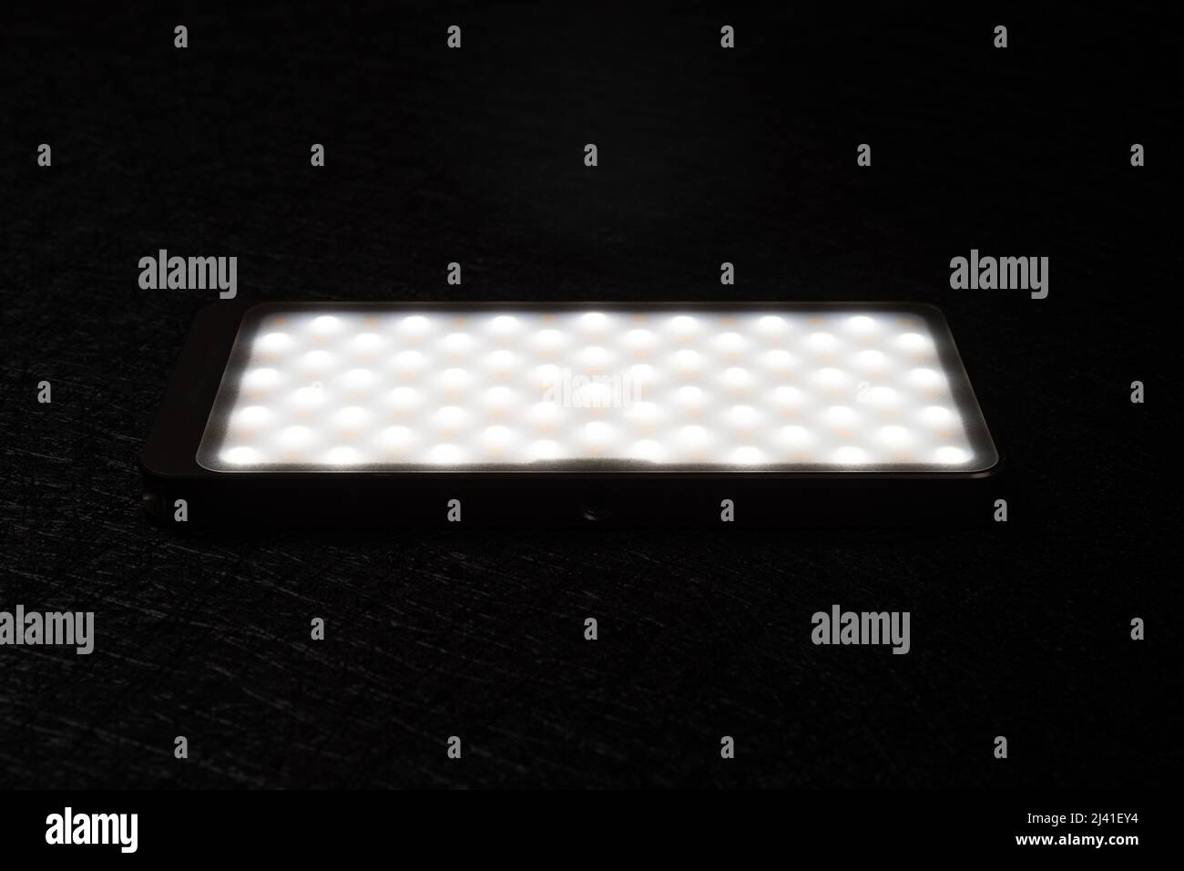 mini portable photography LED light on a dark background Stock Photo ...