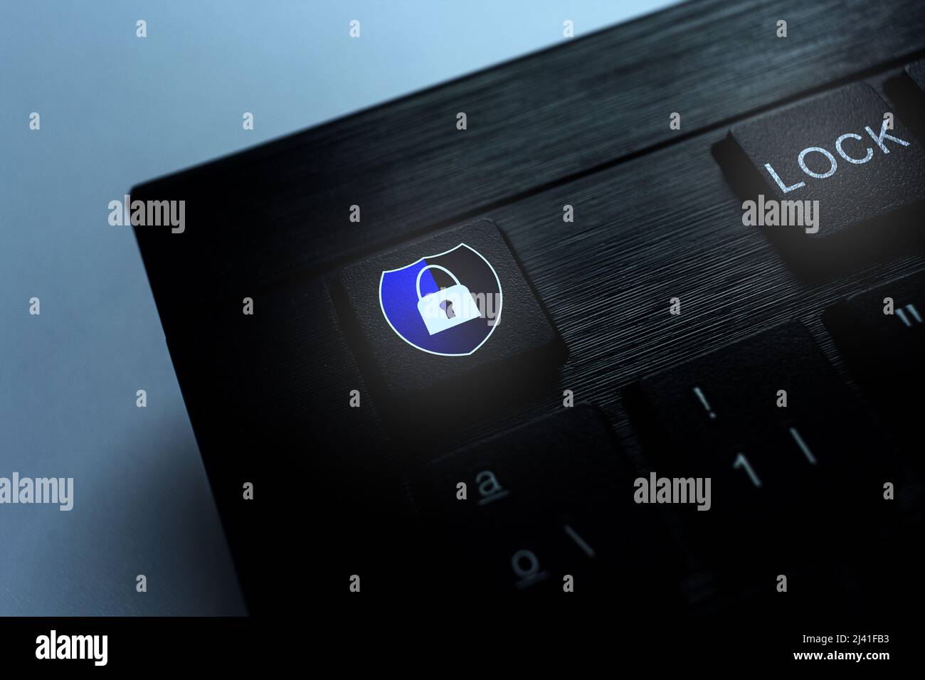 Keyboard with blue security shield concept. Cyber security data ...