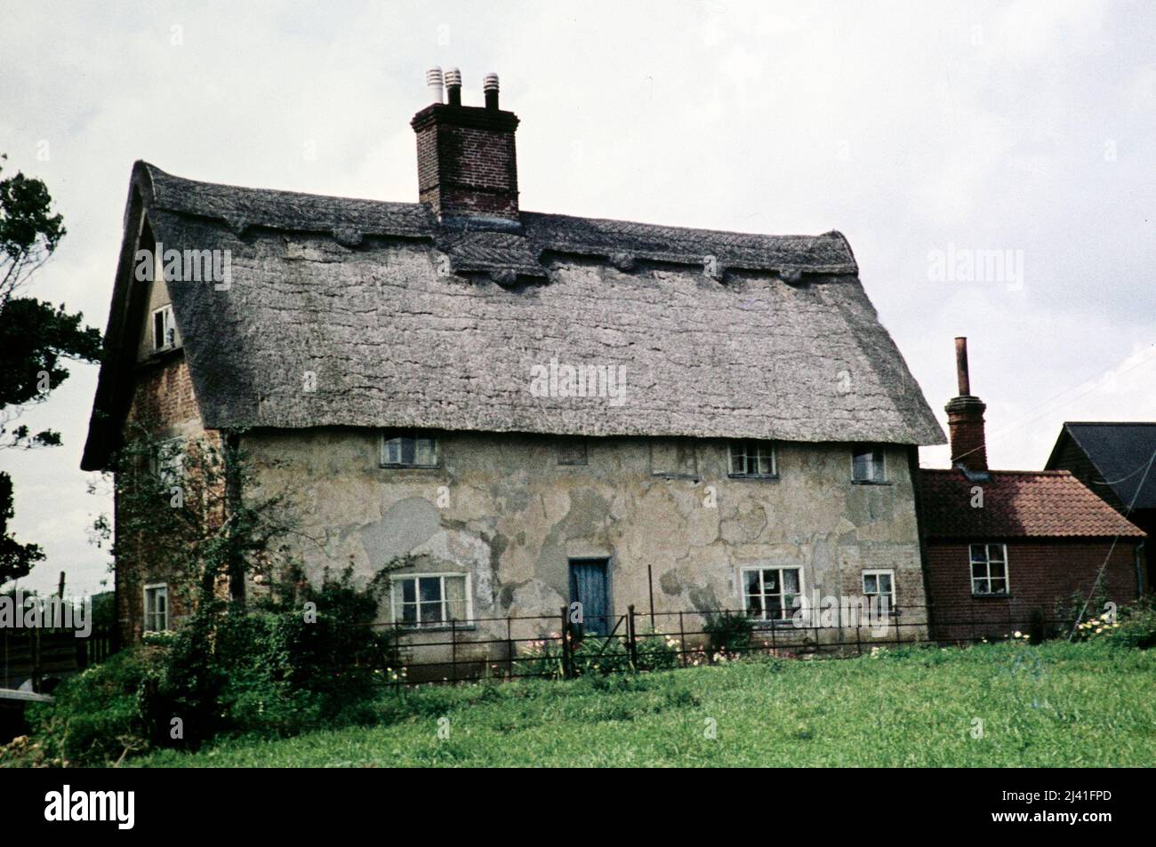 Captioned as 'Old East Anglian mud house', historic thatched rural ...