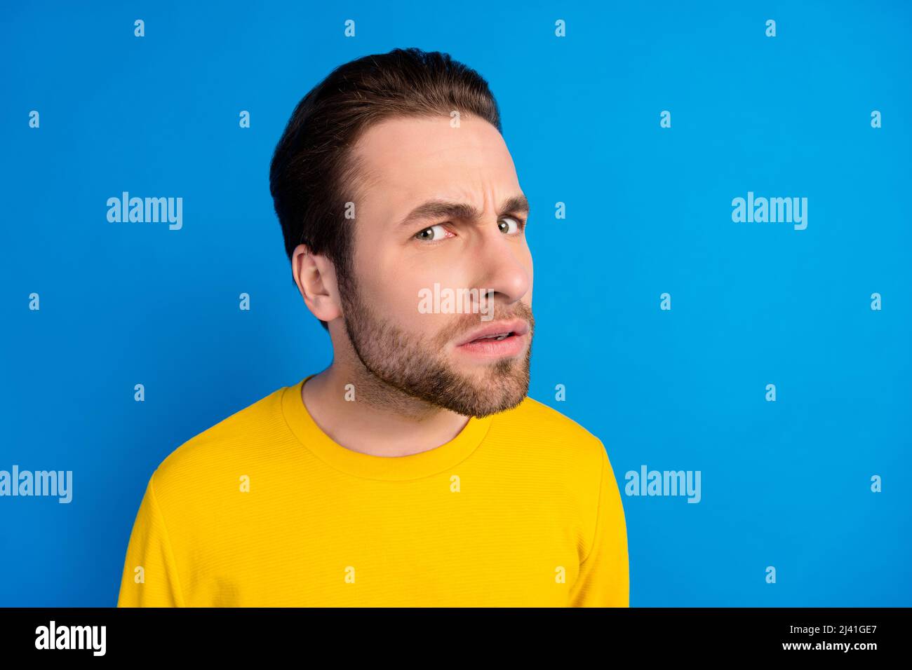 Portrait of attractive funny suspicious doubtful brunet guy looking ...