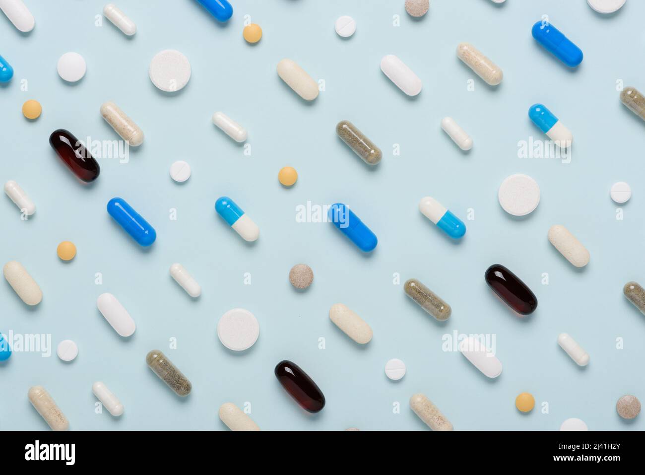 Medicine pills drugs pattern on blue background top view Stock Photo ...