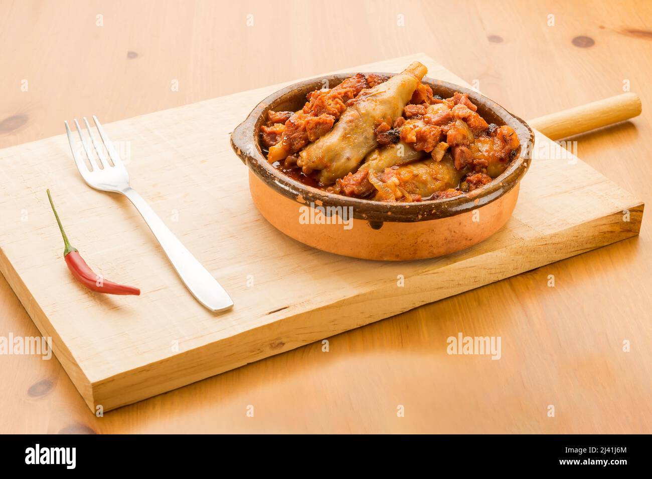 Typical Spanish food, lamb trotters with ham and chorizo Stock Photo ...