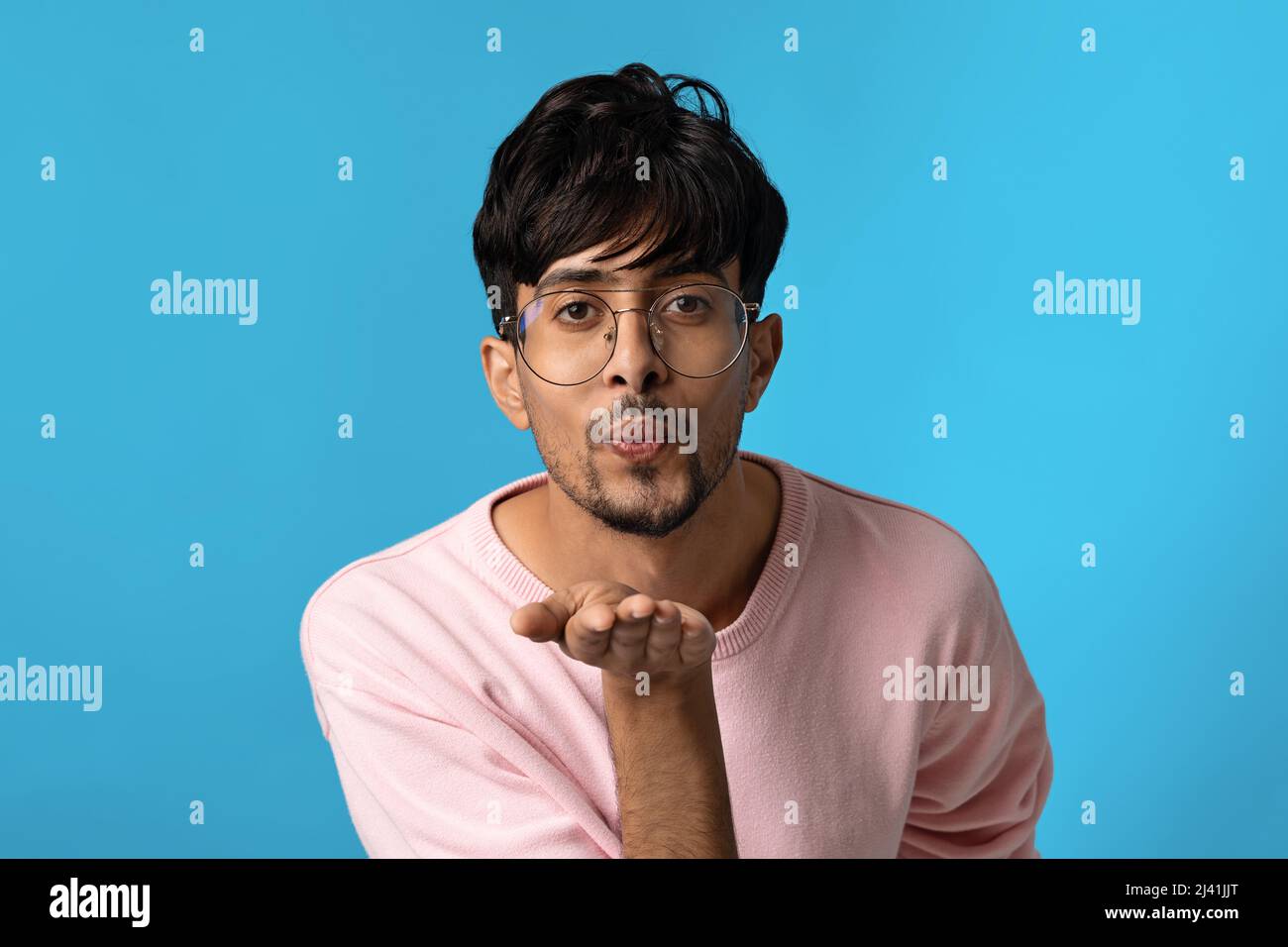 Romantic middle eastern guy showing fly kiss Stock Photo - Alamy