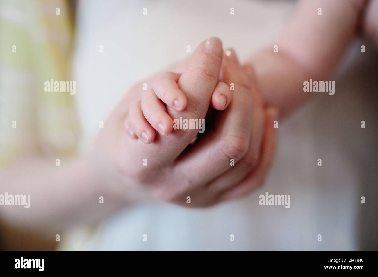 A new baby's touch Stock Photo - Alamy