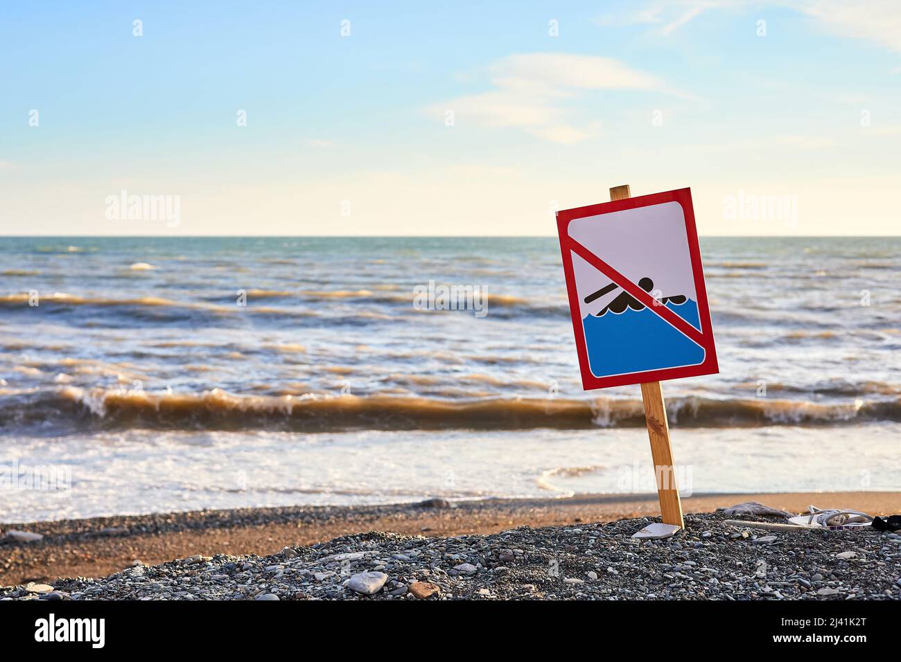 Warning no swimming sign with strong sea wave by the beach background ...