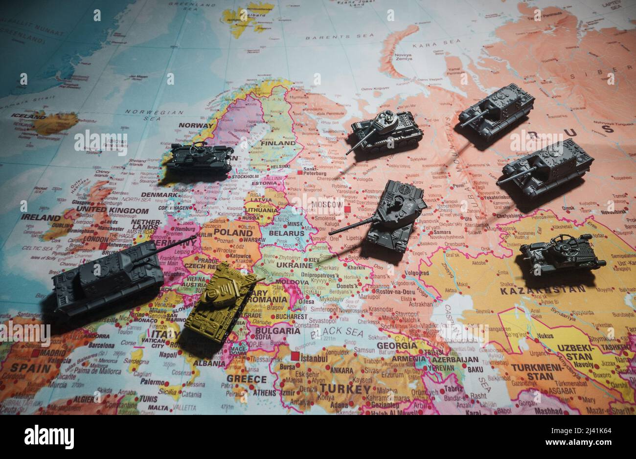Toy tanks on the map. Concept of confrontation between Europe and ...