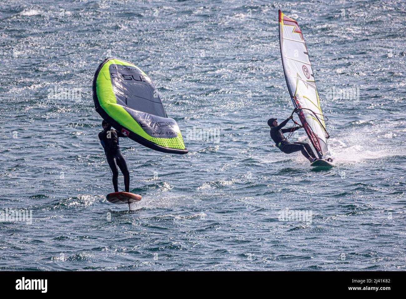 Wind Surfer and board sailor sailing across Mounts Bay - photographed ...