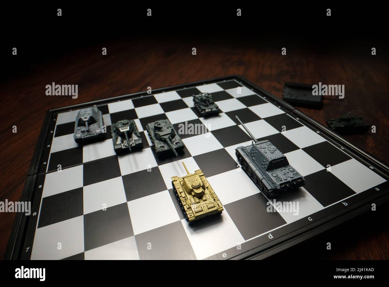 Toy tanks on a chessboard. The concept of military strategy Stock Photo ...