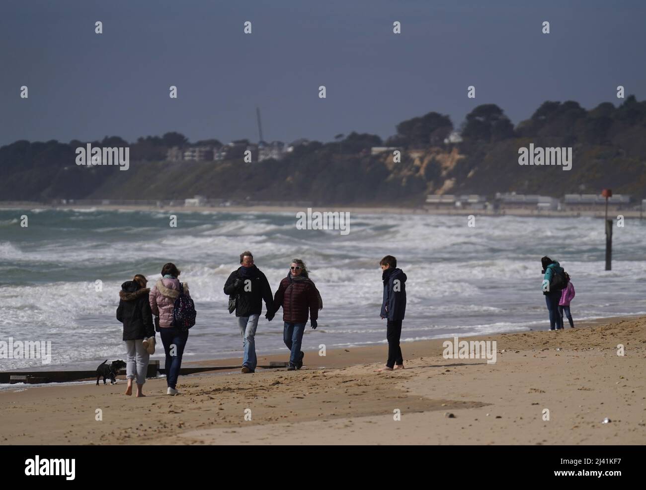 People walk along the beach in Bournemouth. Picture date: Monday April ...