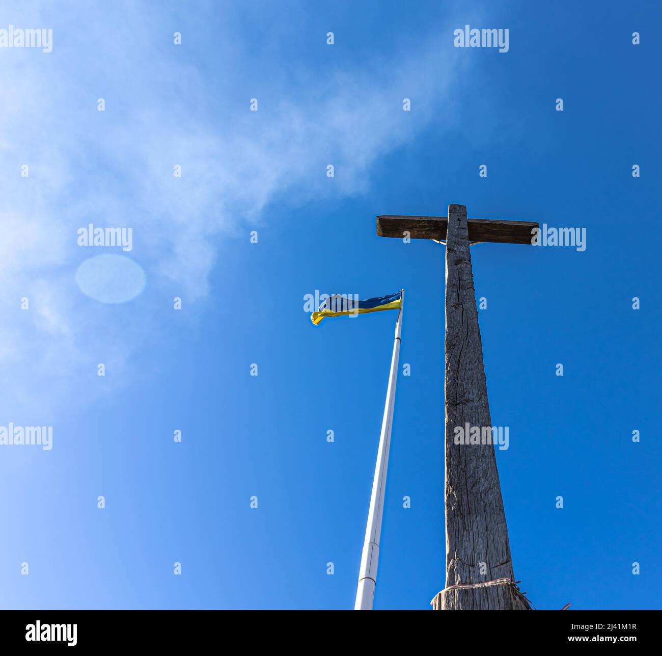 The crucifixion of Jesus Christ and the flag of Ukraine against the ...
