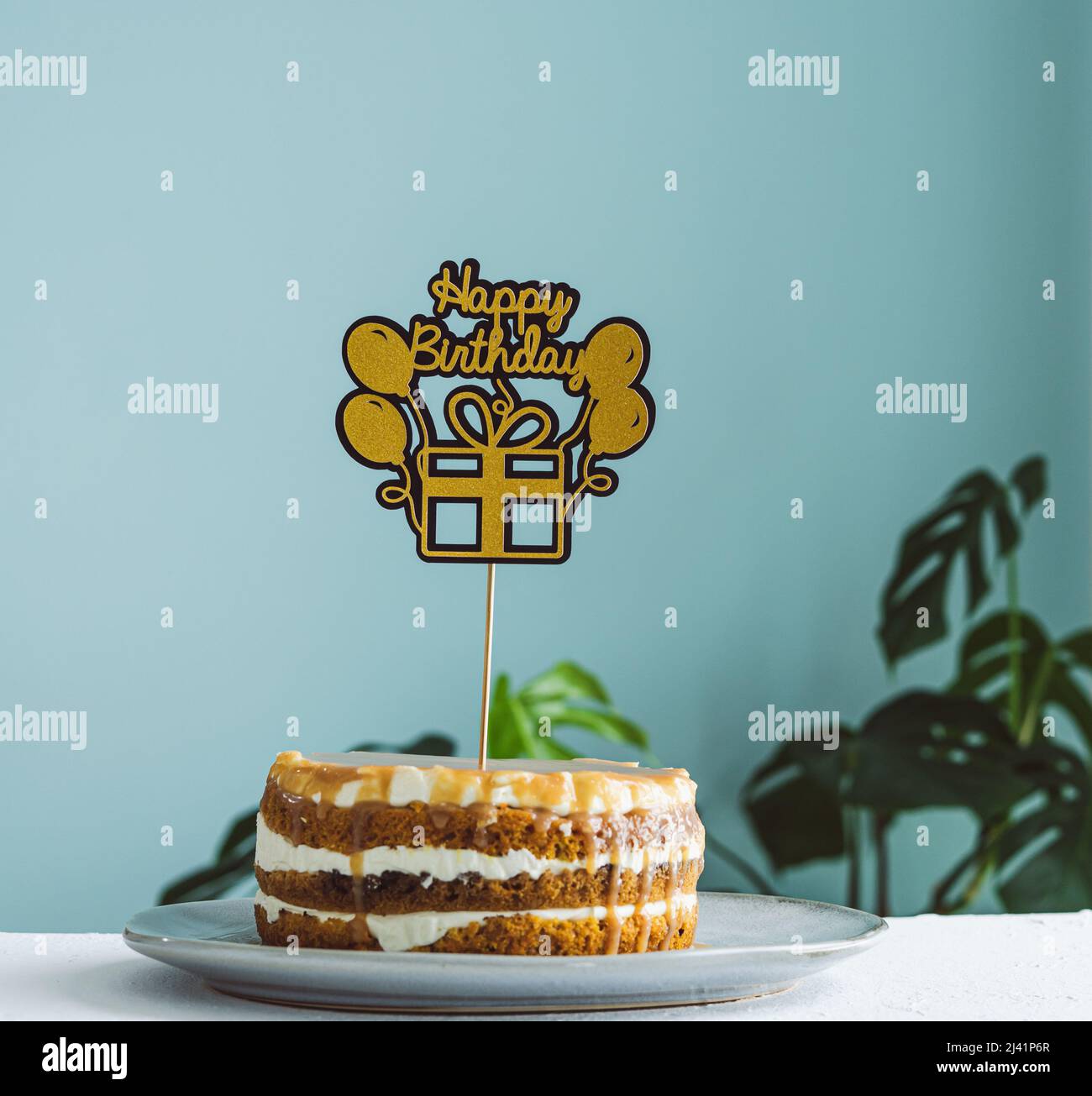 Cake with Birthday topper. Copy space. Blurred background Stock Photo ...