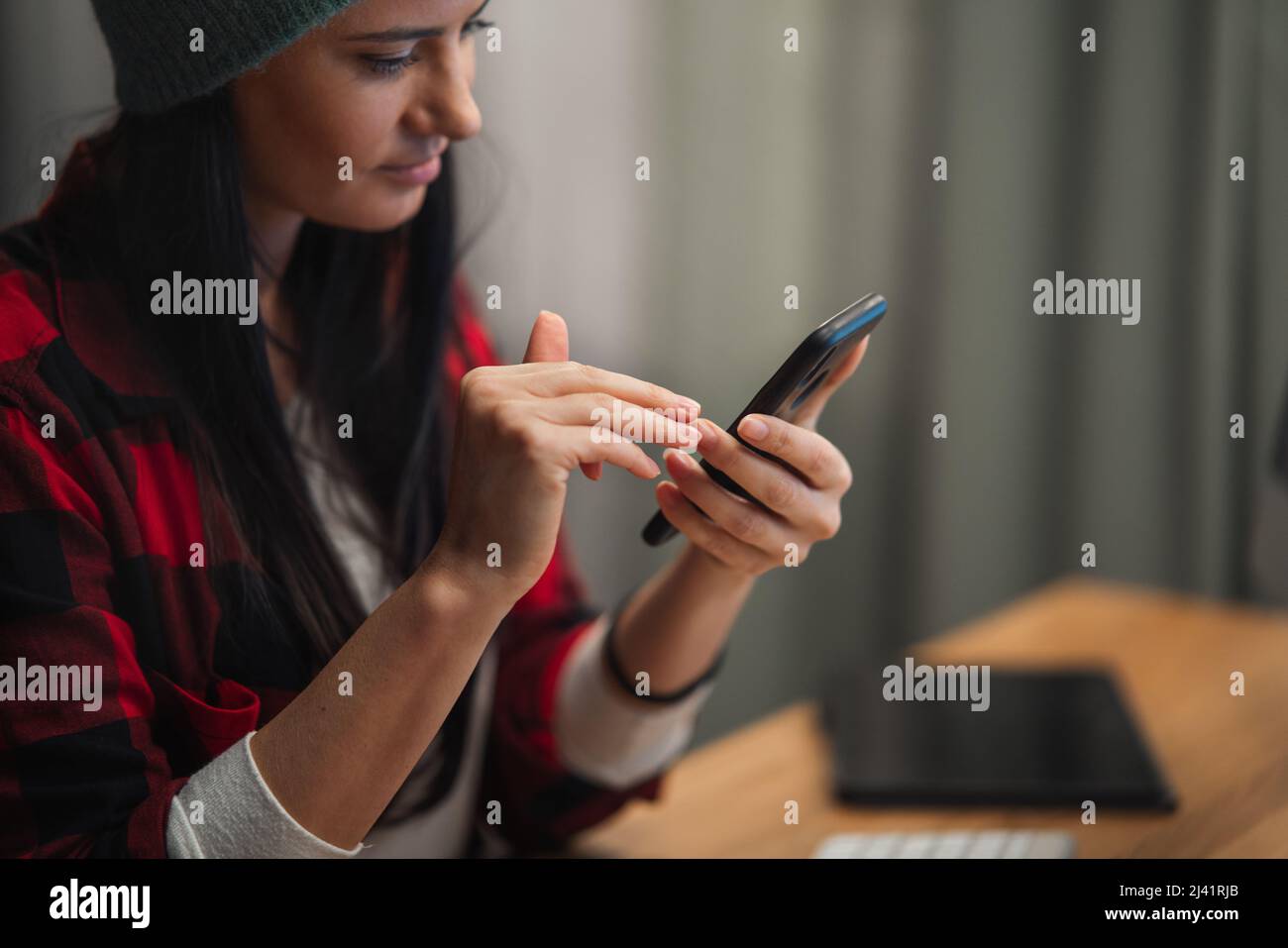Happy female video editor works indoors in creative office studio Stock ...