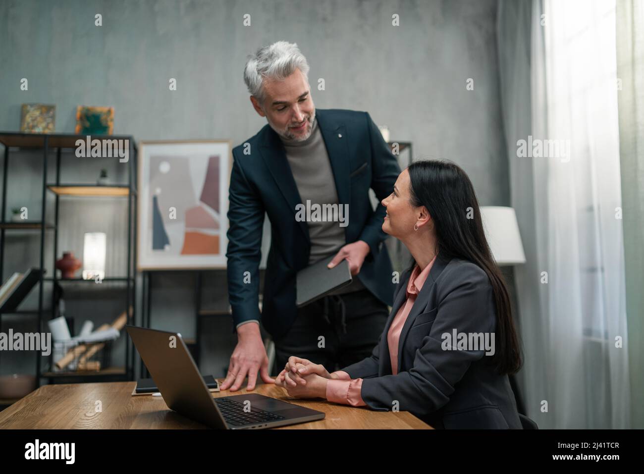 Business team working together on project in office Stock Photo - Alamy