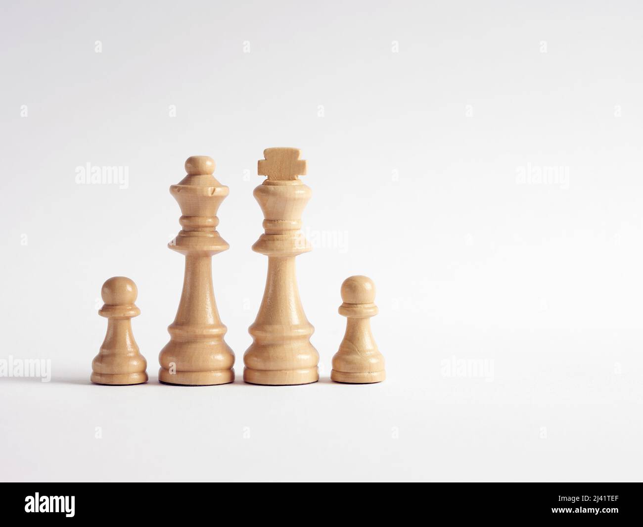 Chess pieces representing a family with two children Stock Photo - Alamy