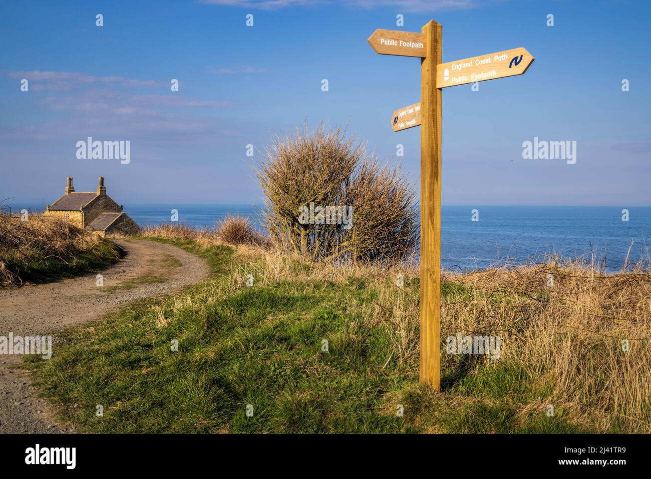 A footpath sign on the Northumberland Coast Path with the Howick ...