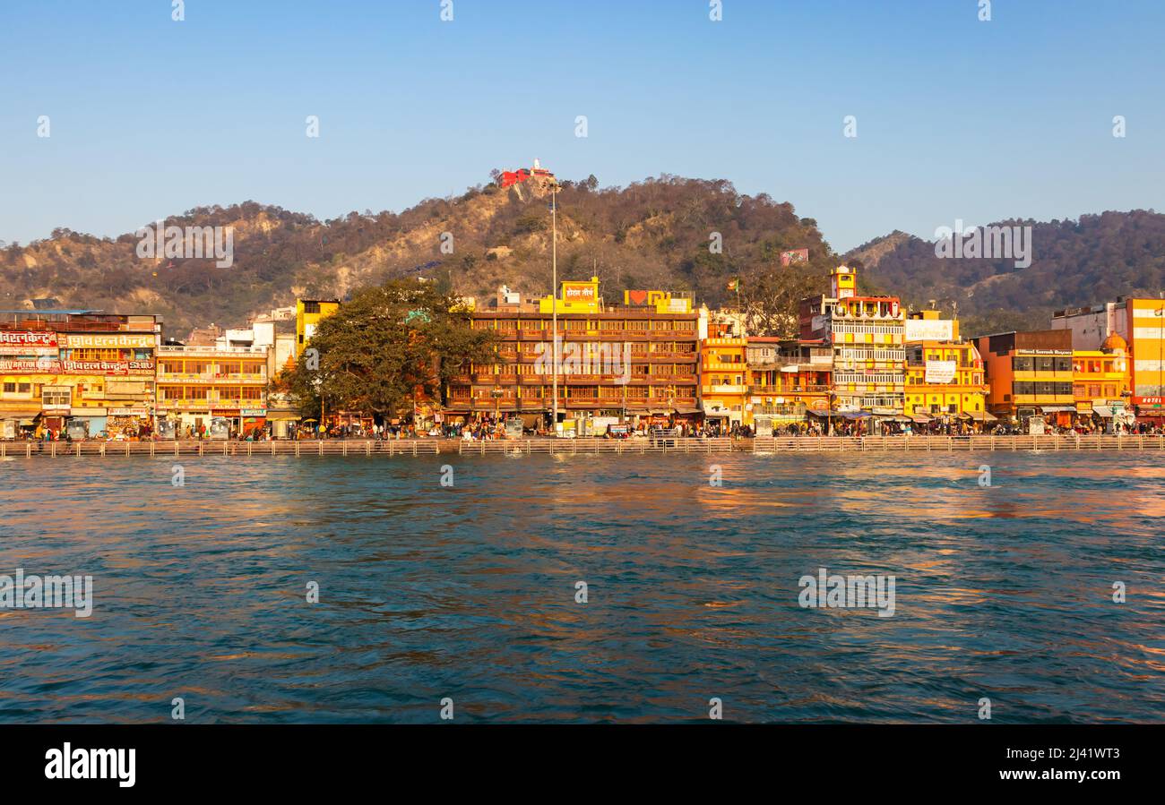 city view at the shore of flowing river at morning from flat angle ...