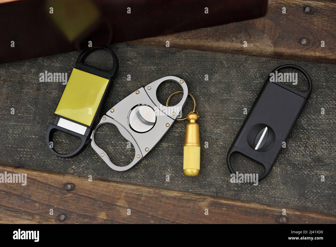 Flatlay Assortment of Cigar Cutters on Rustic Wood Table Beside Cigar ...