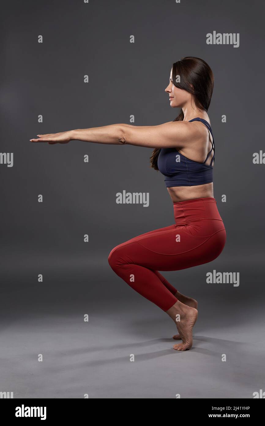 Woman balancing chair hi-res stock photography and images - Alamy