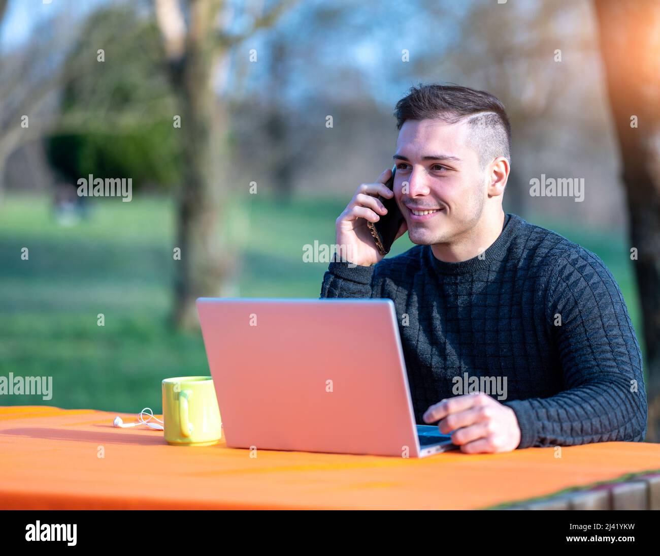 Portrait of attractive young office worker in casual wear, receives a ...