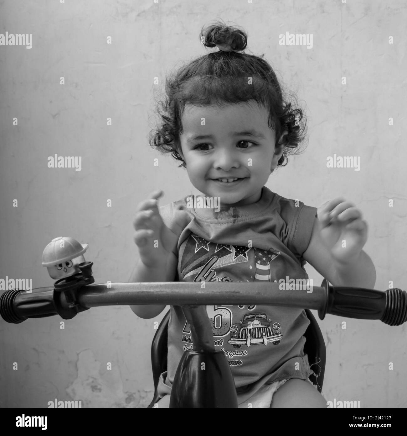 Cute little boy Shivaay driving cycle at home balcony during summer ...