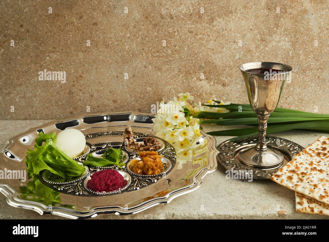 Passover Seder plate with traditional food ontravertine stone ...