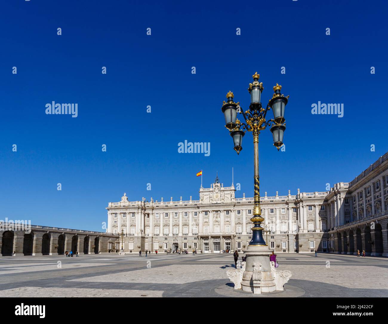 Ornate gilded lamp post in the courtyard of the baroque architecture ...