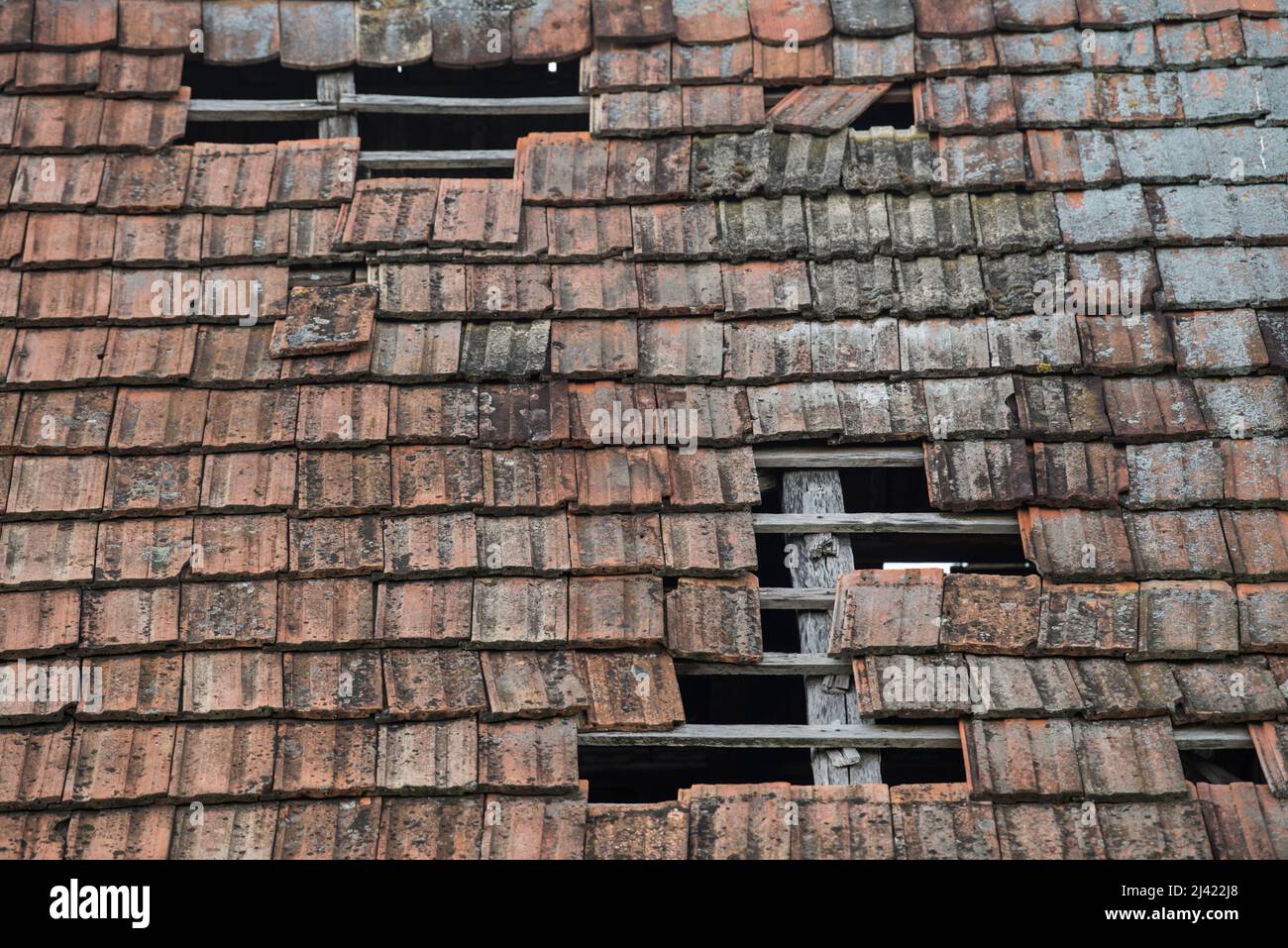Ruined tiles on the old house Stock Photo - Alamy