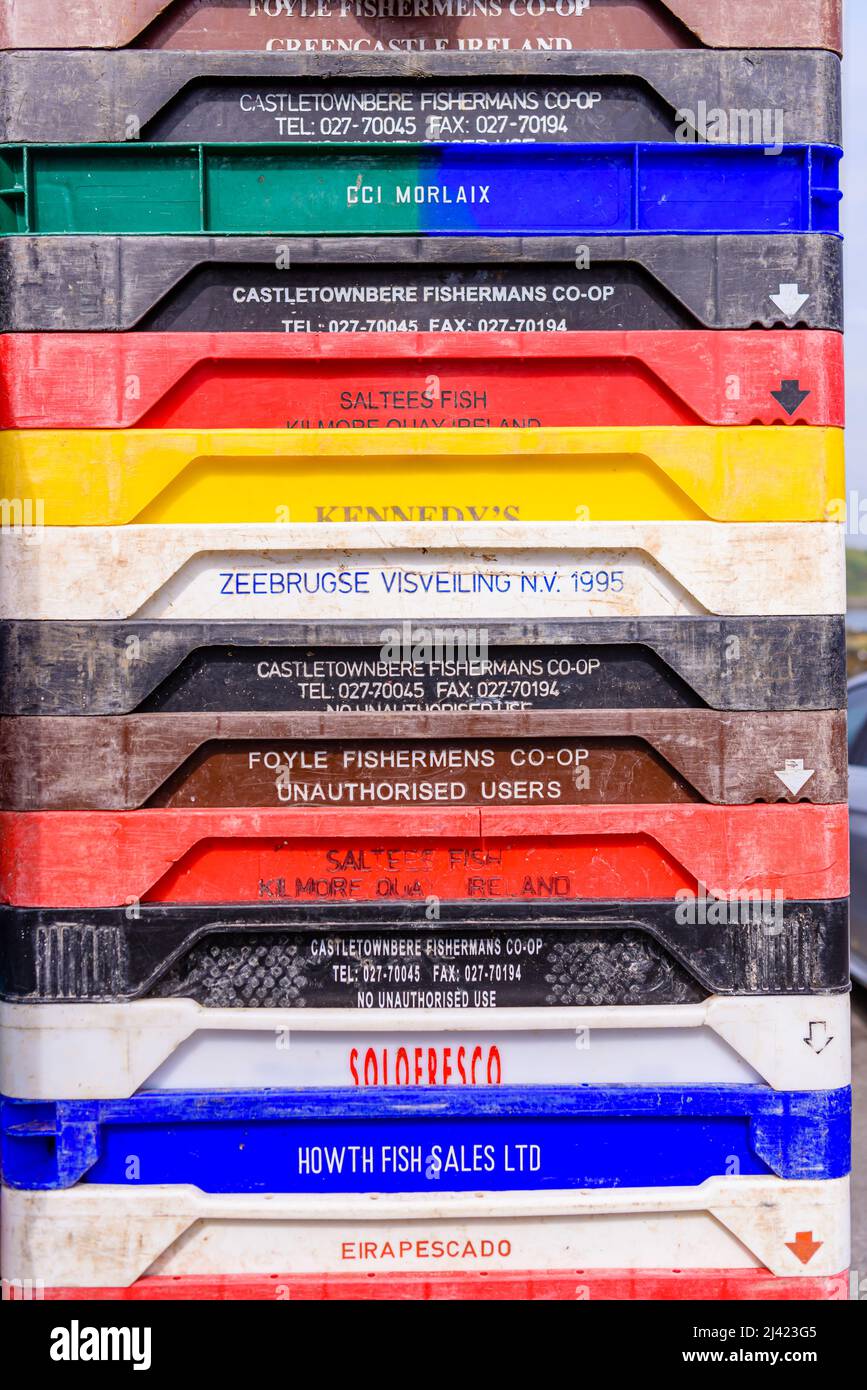 Stack of multi-coloured plastic fish crates Stock Photo - Alamy