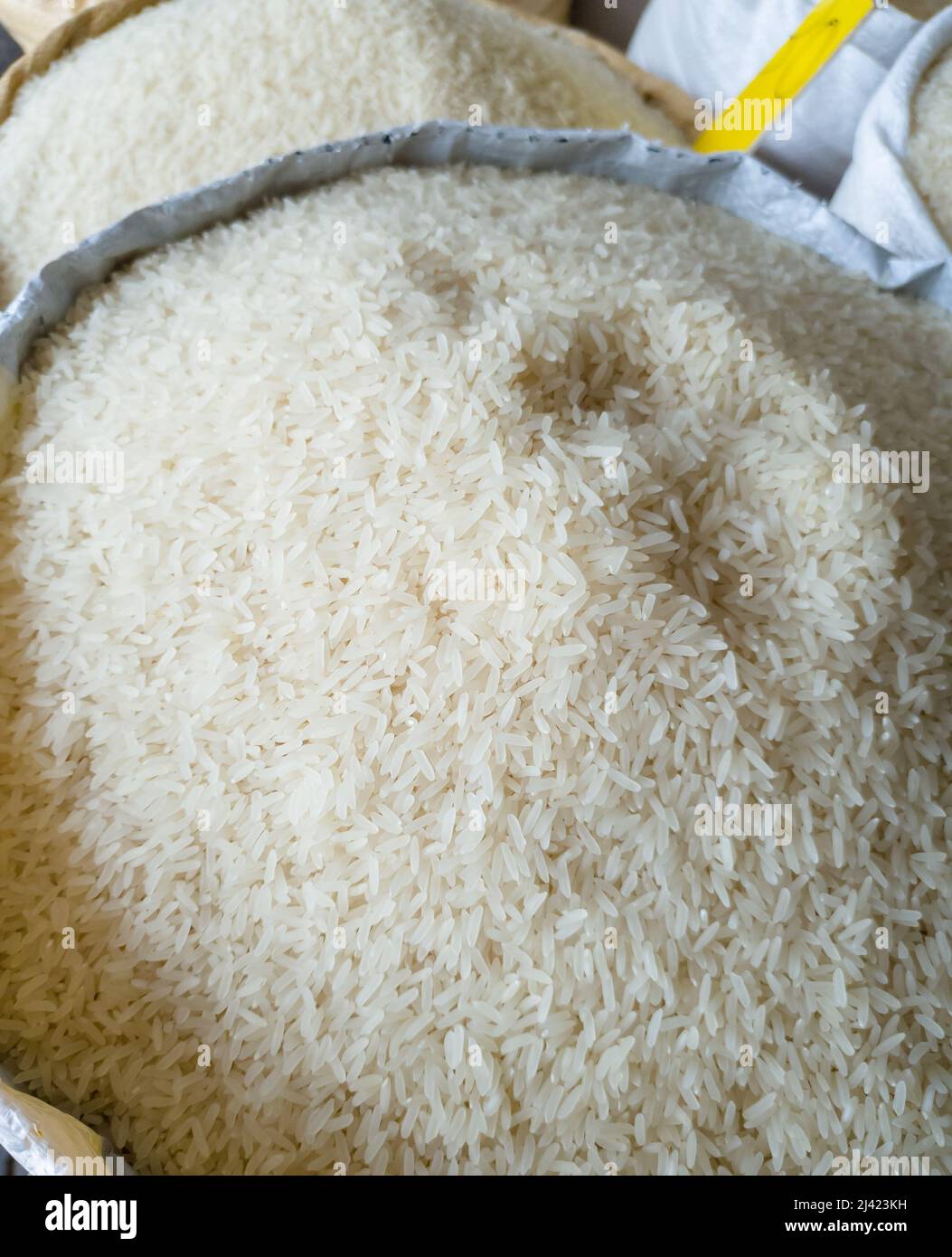 Several sacks of raw white rice at a food market in the Dominican ...