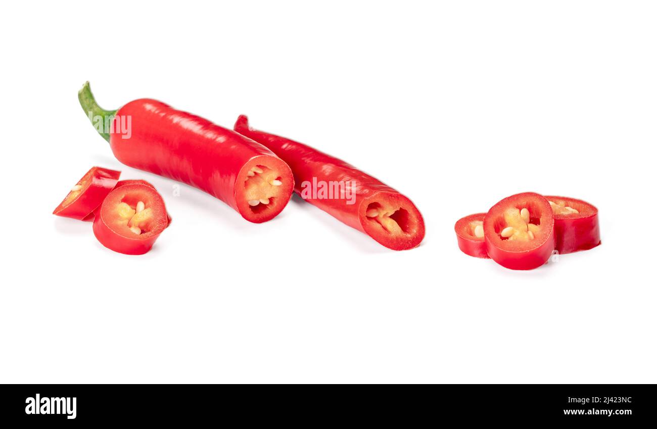 cut red hot chili peppers, Capsicum isolated on white background ...