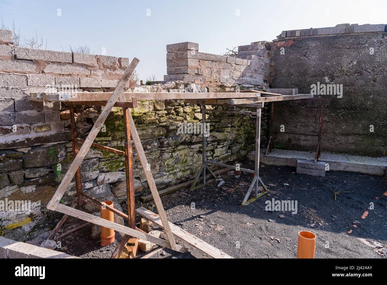 Wooden planks supported on trestlesat a building site Stock Photo - Alamy
