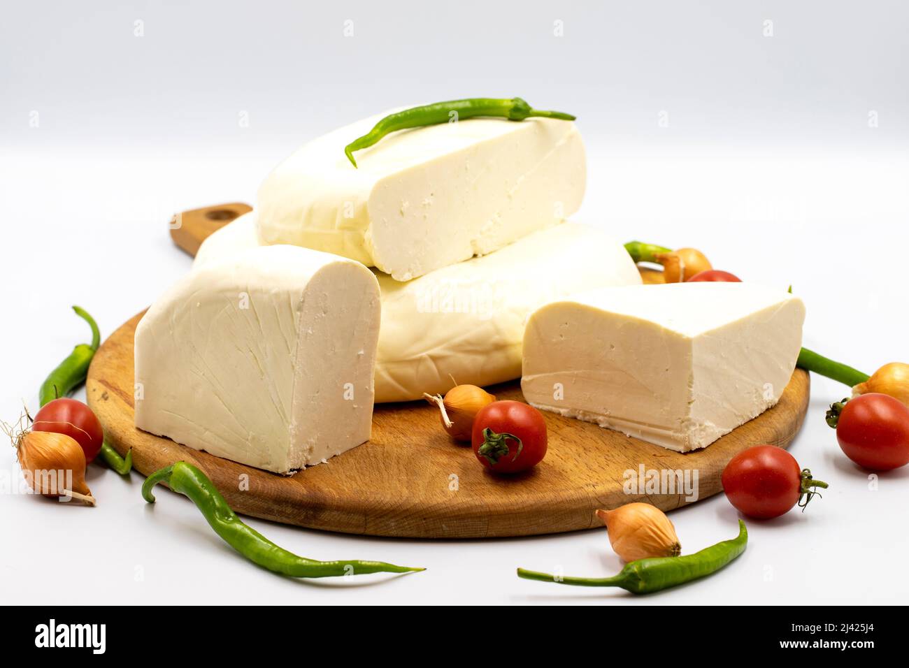 Fresh feta cheese on a white background. Delicious assortment of ...