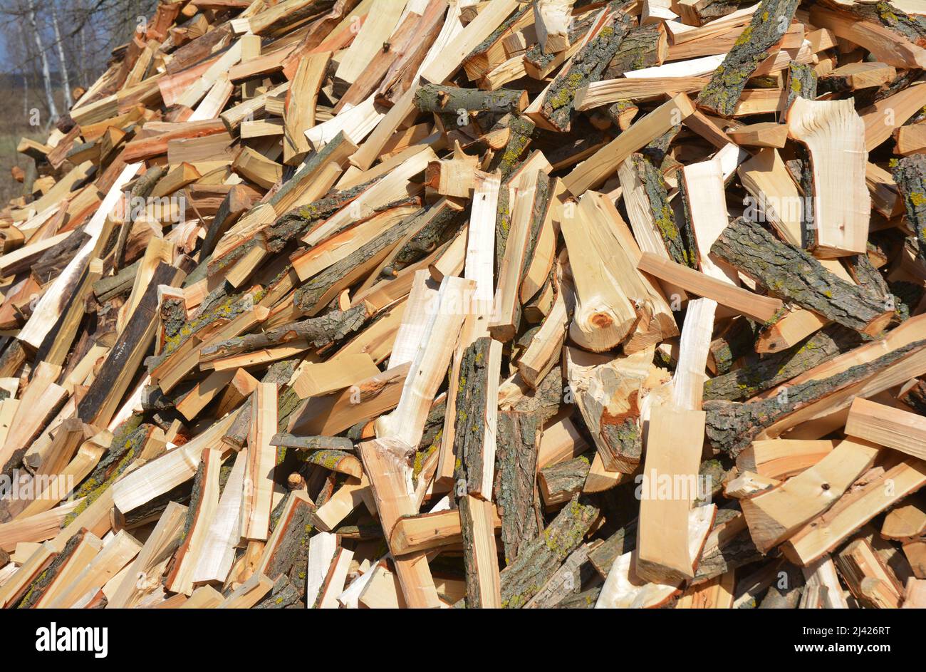Split firewood background. A large pile of split firewood Stock Photo ...
