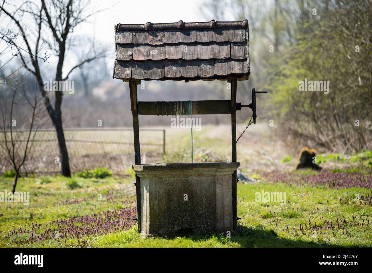 An old well at the farm. Well for drawing water located in the ...