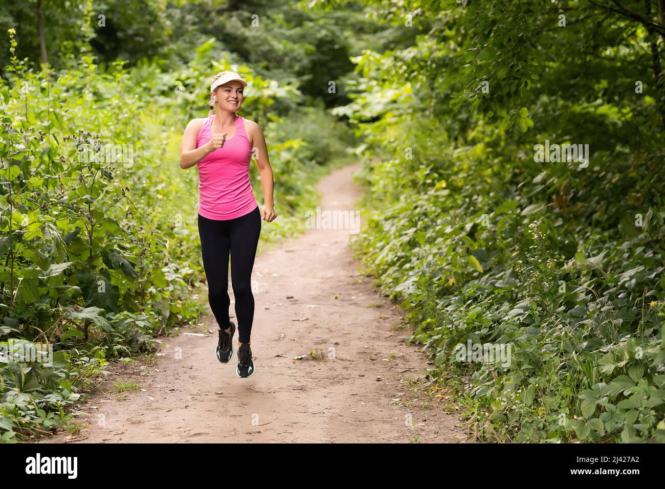 Running woman. Female Runner Jogging during Outdoor Workout in a Park ...