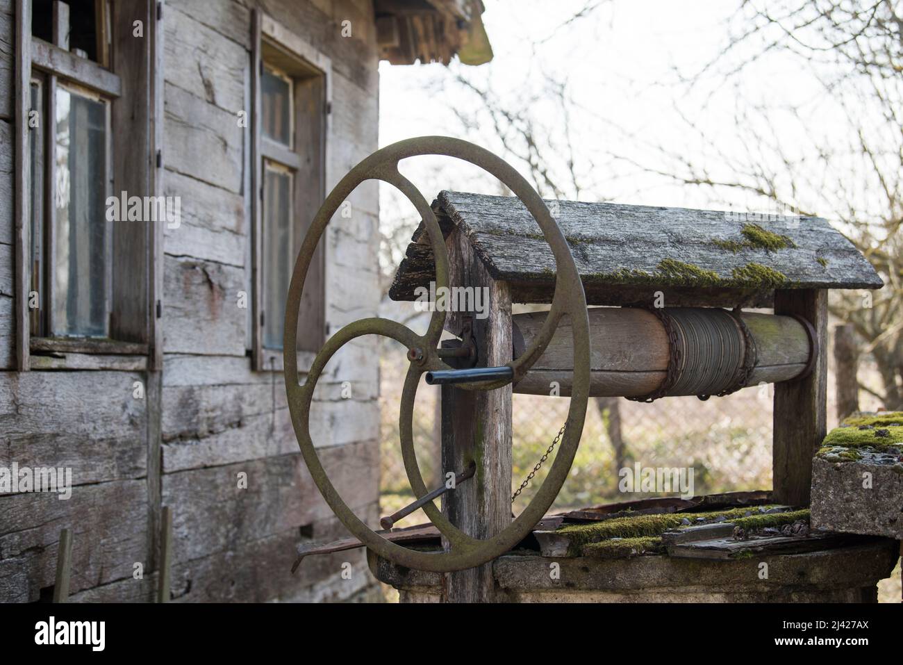 An old well at the farm. Well for drawing water located in the ...