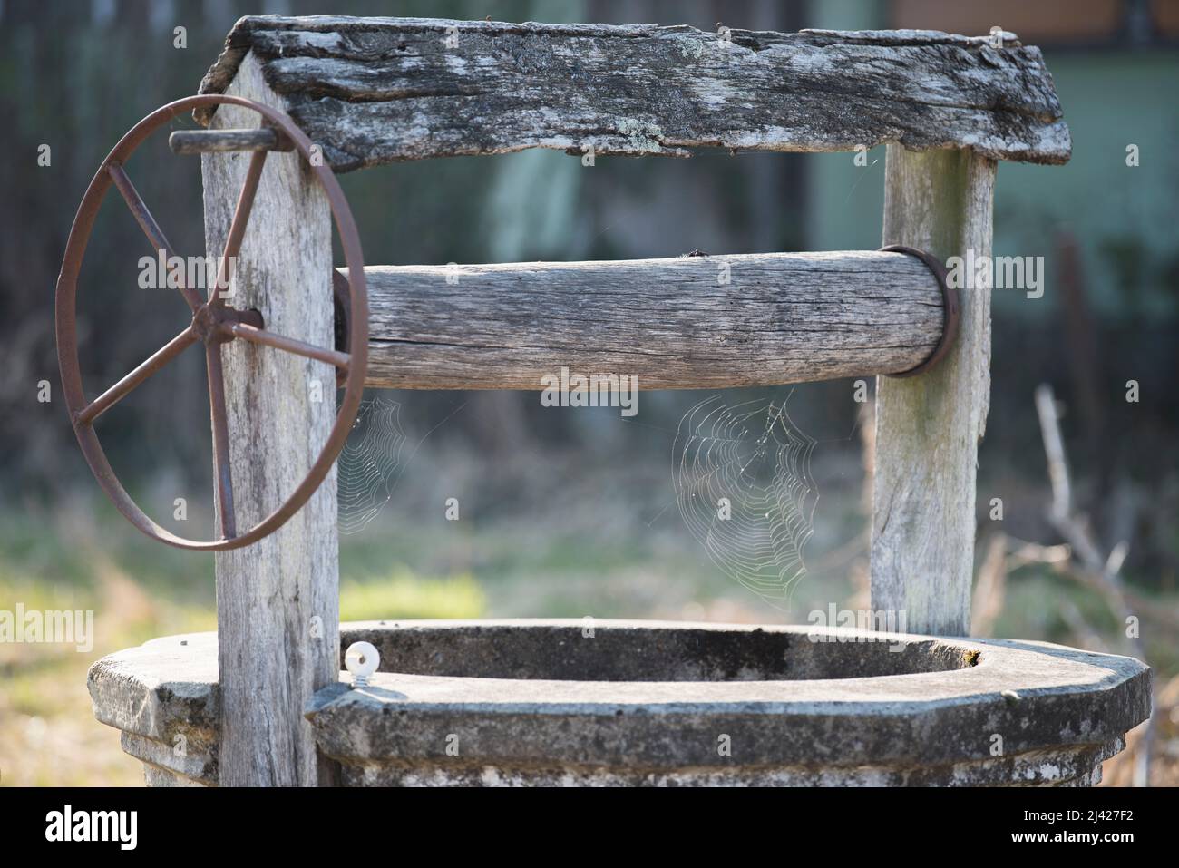 An old well at the farm. Well for drawing water located in the ...