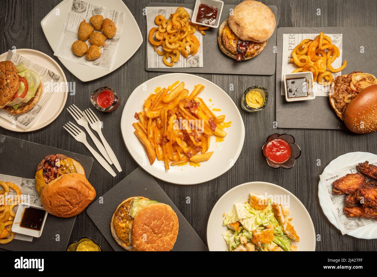 Fast food dishes with assorted hamburgers, fish croquettes, chicken ...