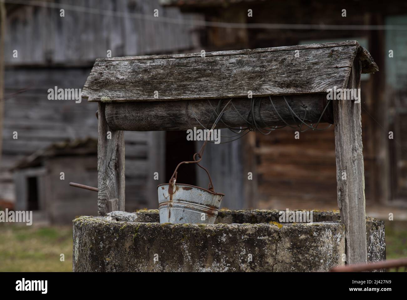 An old well at the farm. Well for drawing water located in the ...