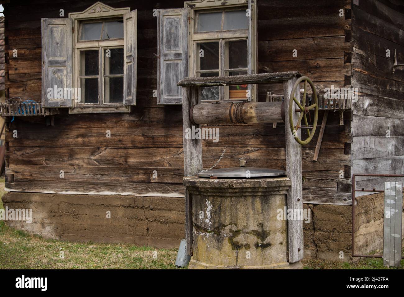 An old well at the farm. Well for drawing water located in the ...