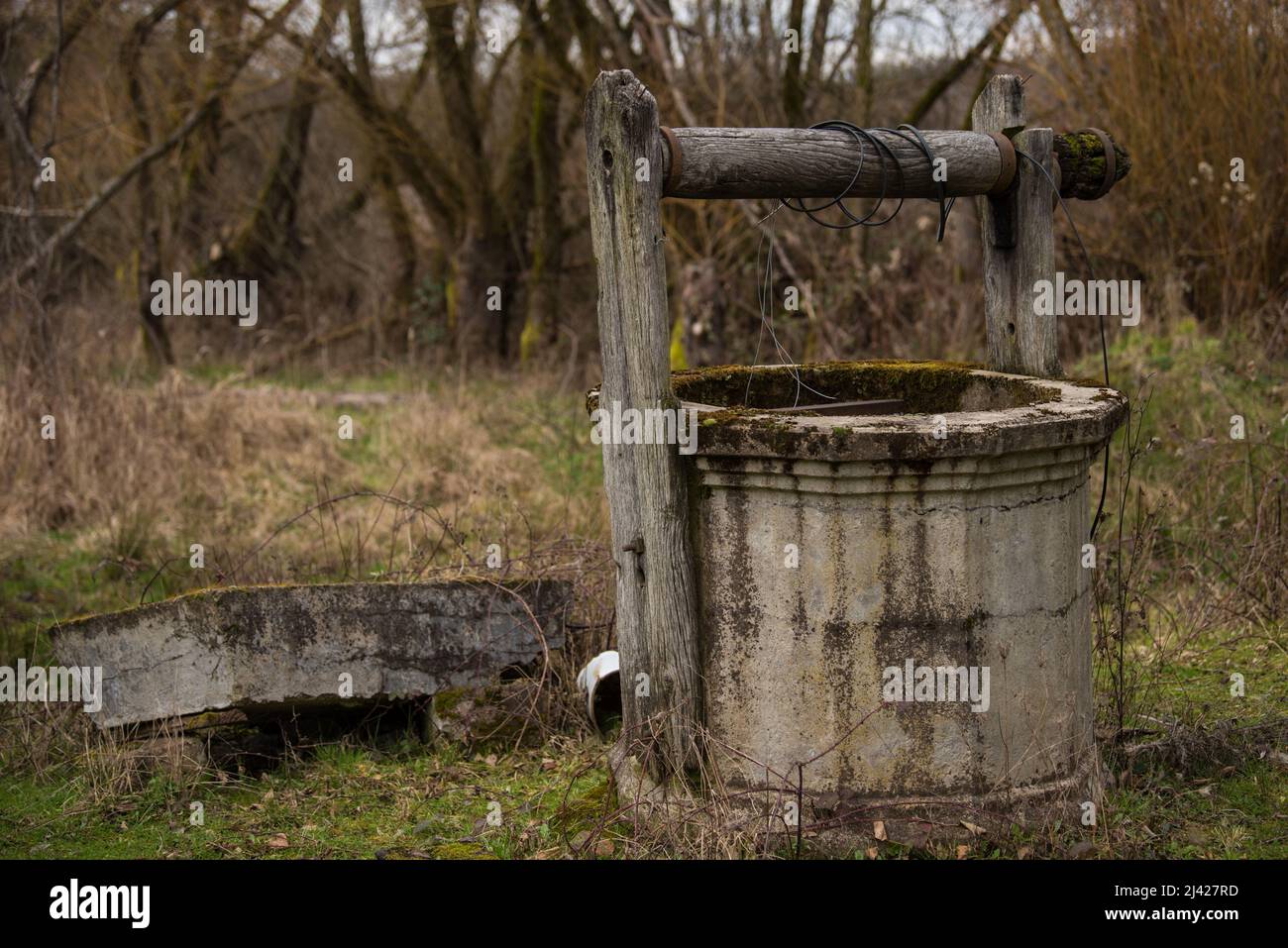 An old well at the farm. Well for drawing water located in the ...