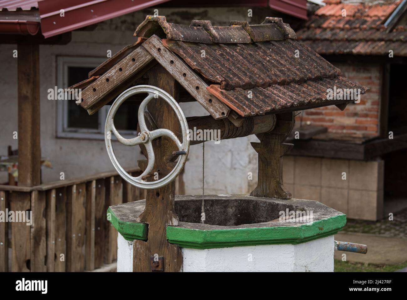 An old well at the farm. Well for drawing water located in the ...