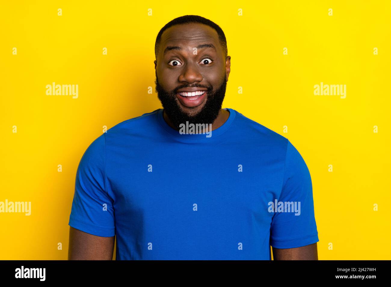 Portrait of attractive cheerful amazed guy wearing blue t-shirt good ...