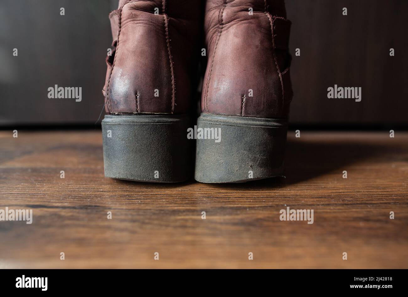 Pair of worn out brown leather shoes back view closeup Women's shoes ...