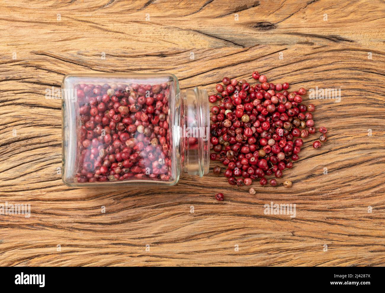 Top view, closeup of dried red pepper grains on a glass pot Stock Photo ...