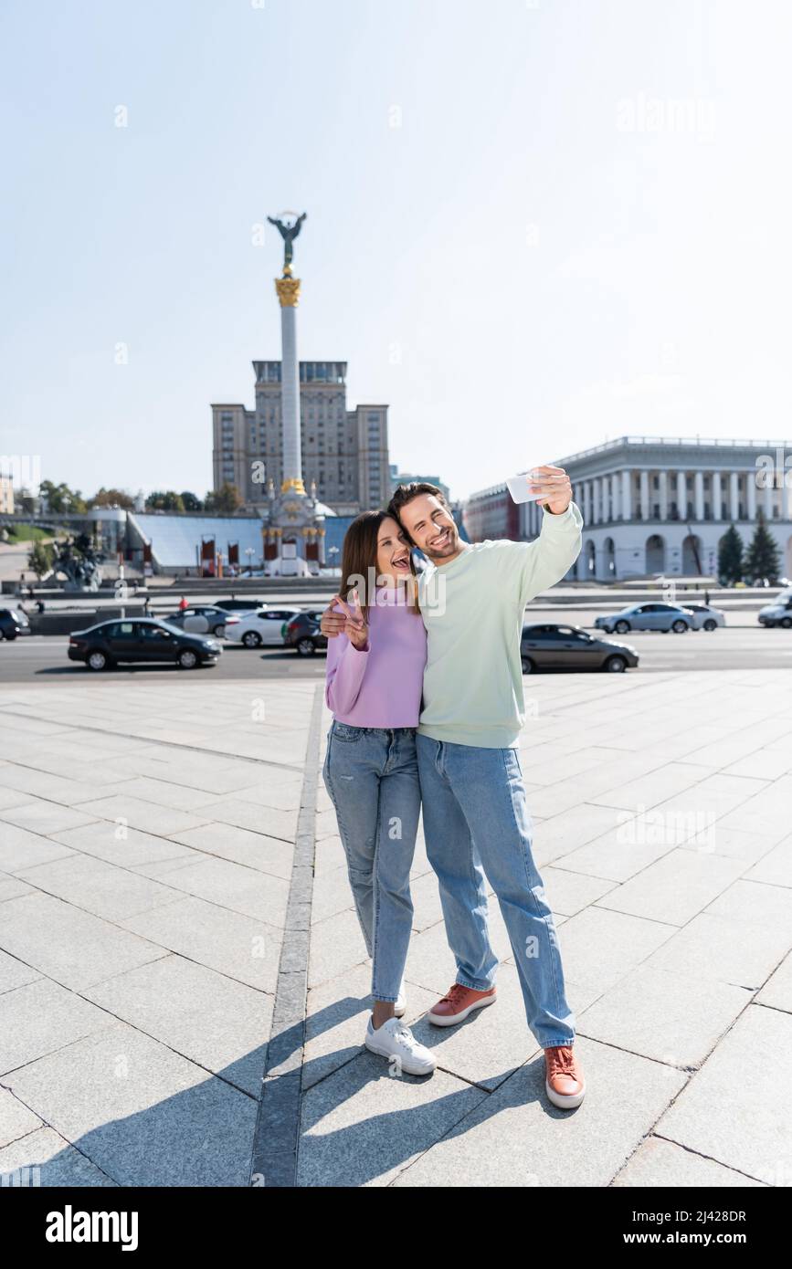 KYIV, UKRAINE - SEPTEMBER 1, 2021: Smiling couple taking selfie on ...