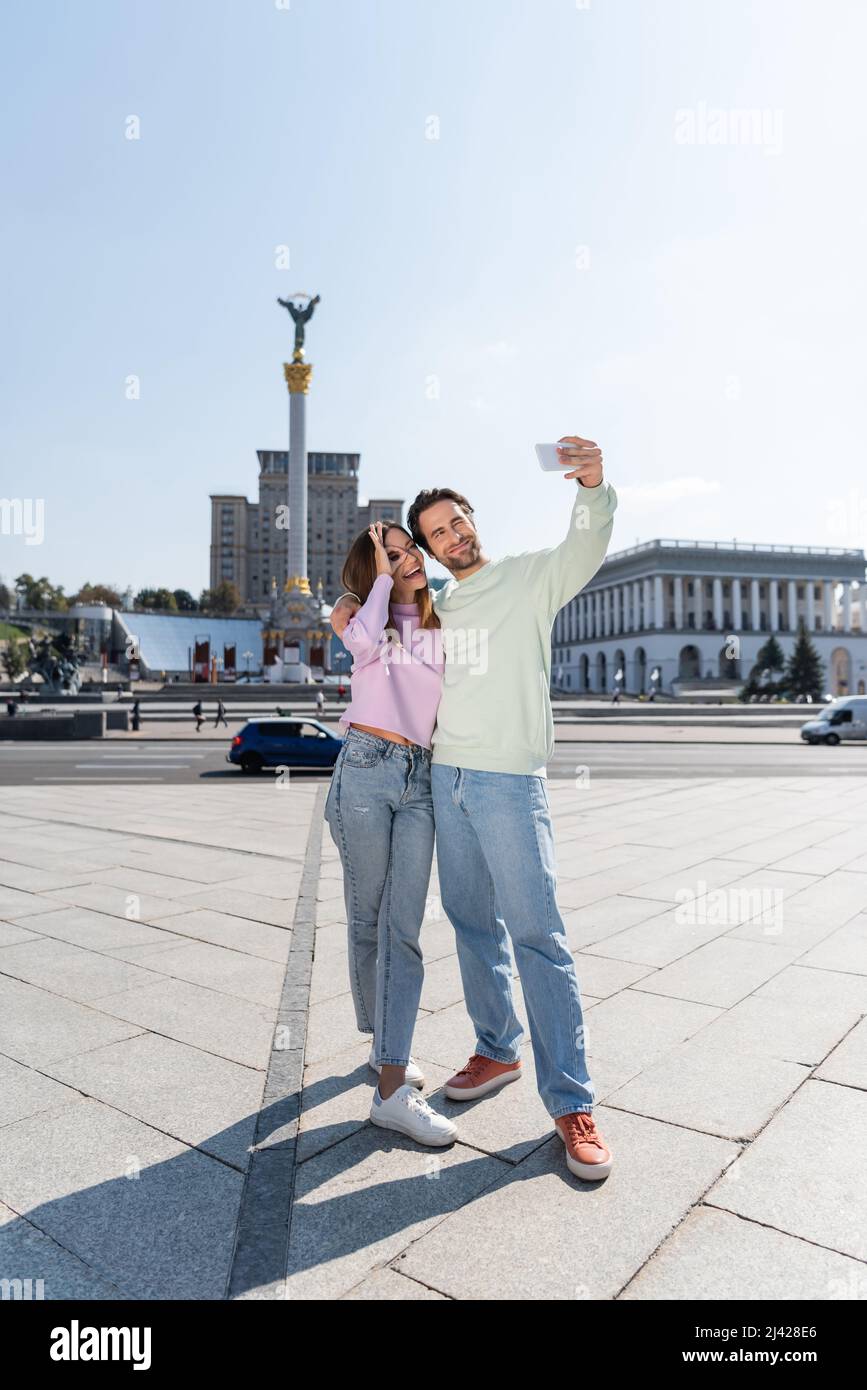 KYIV, UKRAINE - SEPTEMBER 1, 2021: Smiling couple taking selfie on ...