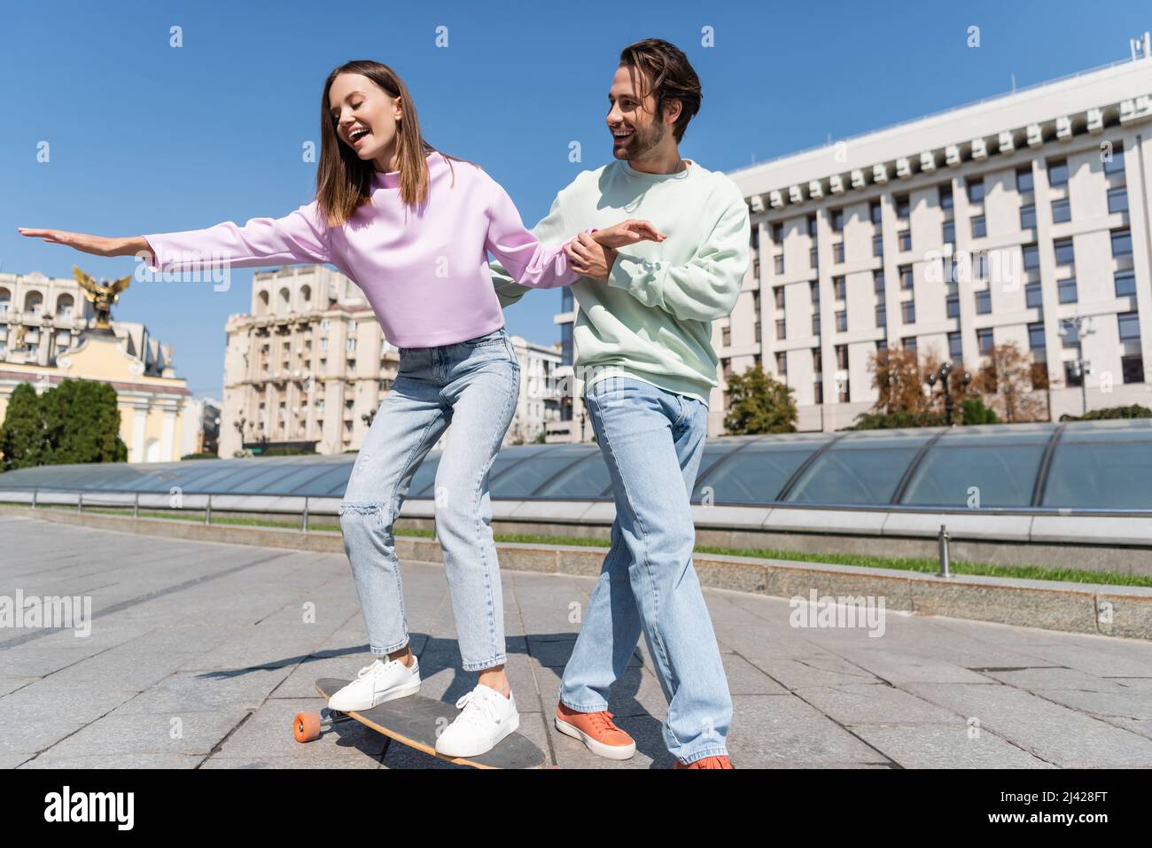 Woman riding penny board hi-res stock photography and images - Alamy