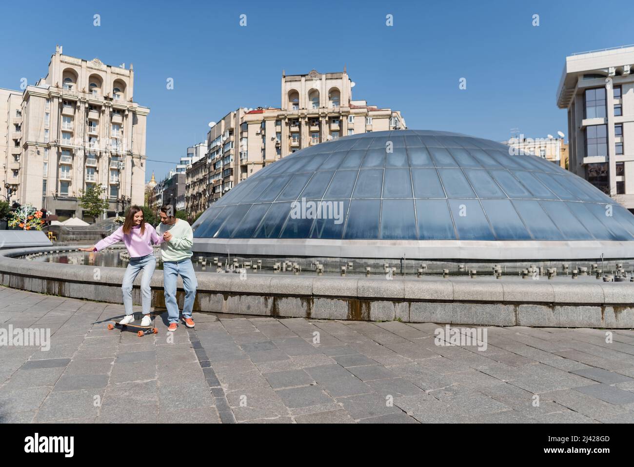 Woman riding penny board hi-res stock photography and images - Alamy